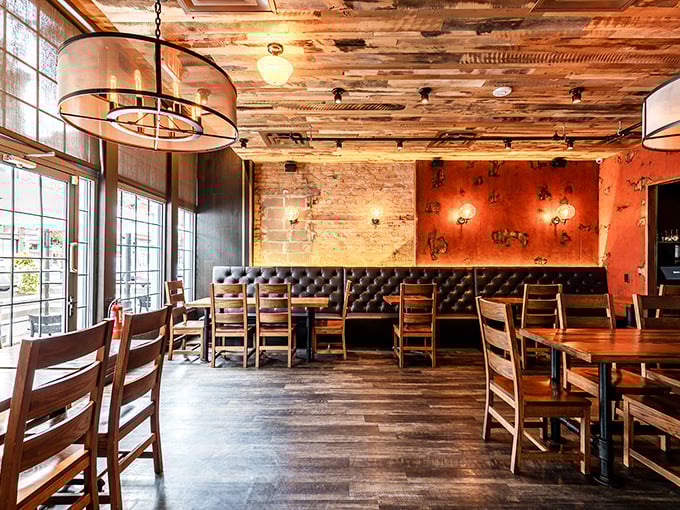 The dining room balances industrial chic with cozy comfort—those leather banquettes practically beg you to settle in for an afternoon of serious eating.