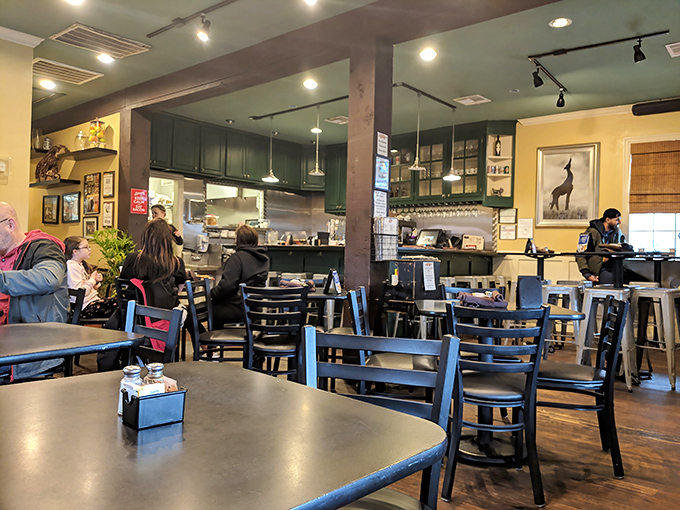 The dining area balances diner practicality with neighborhood charm – those blue chairs have heard thousands of "pass the syrup" requests.