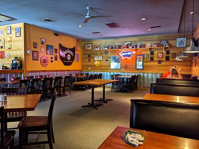 The dining room's warm wood tones and pig-themed décor create an atmosphere where calories don't count and sauce on your shirt is a badge of honor.