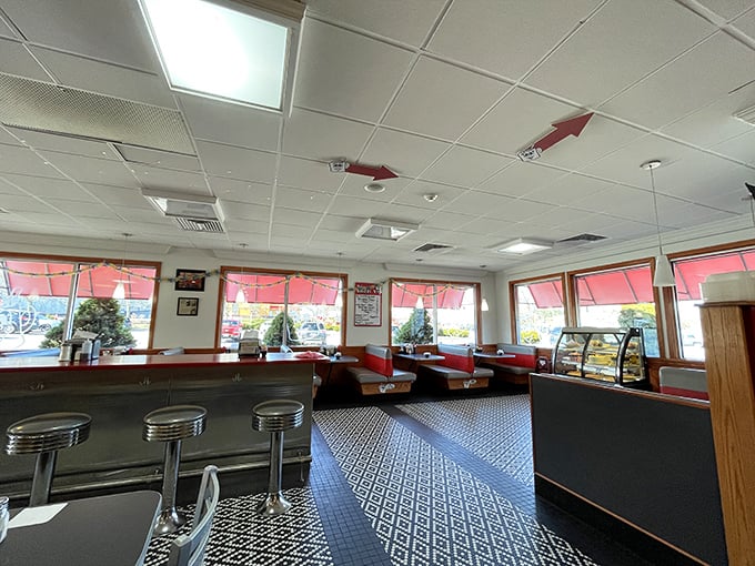 Red Arrow's dining area combines retro charm with practical comfort—those red arrows on the ceiling aren't just decorative; they're pointing you toward deliciousness.