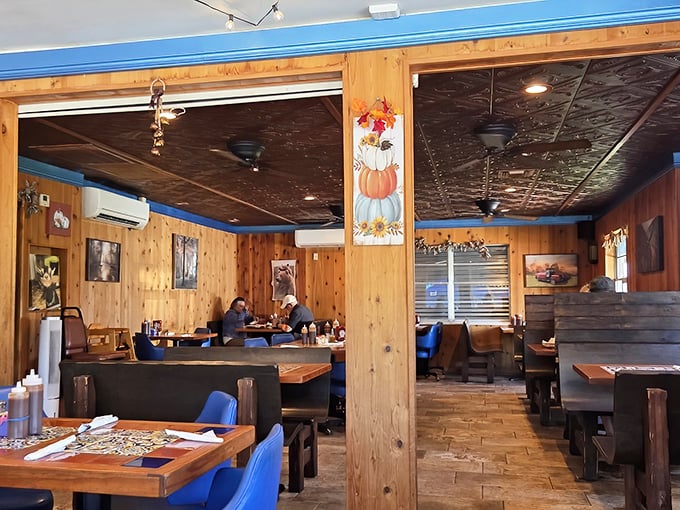 Wooden booths, knotty pine walls, and pressed tin ceiling tiles—dining in what feels like your favorite uncle's cabin, if he happened to be a barbecue master.