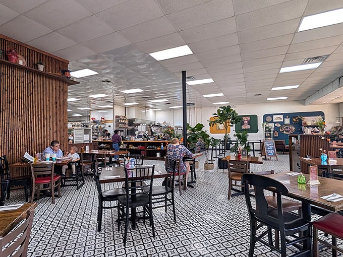 The dining area balances modern and cozy, with patterned floors and wooden accents creating a space where lingering isn't just allowed—it's encouraged.