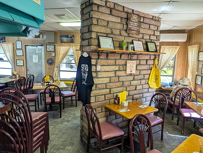 Wood-paneled walls adorned with local memorabilia create the perfect backdrop for tables draped in sunny yellow – comfort food deserves a comfortable setting.