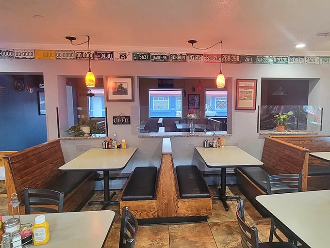 Where license plates meet laminate tables—a dining room that says "we care more about your breakfast than our interior designer's vision."