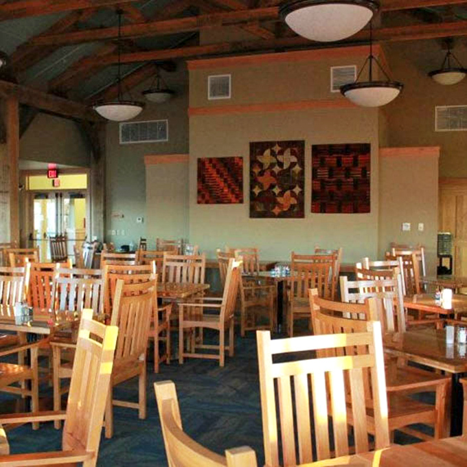 Mission-style furniture and exposed beams create a dining room where Frank Lloyd Wright might have happily tucked into a plate of barbecue.
