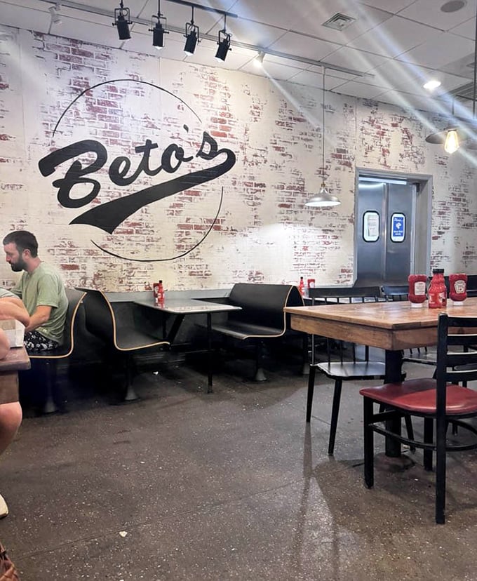 The dining room feels like Pittsburgh itself—unpretentious, genuine, with character etched into every brick. That Beto's logo watches over diners like a benevolent pizza deity.