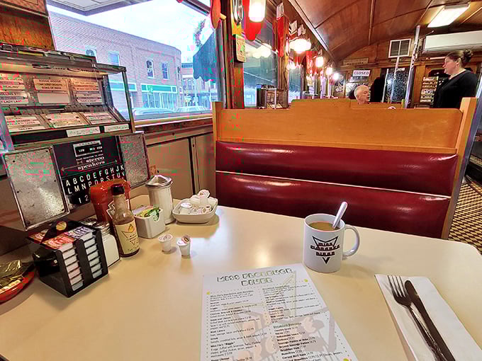 The quintessential diner booth experience – where coffee mugs are always full and the menu promises possibilities as endless as the conversations.