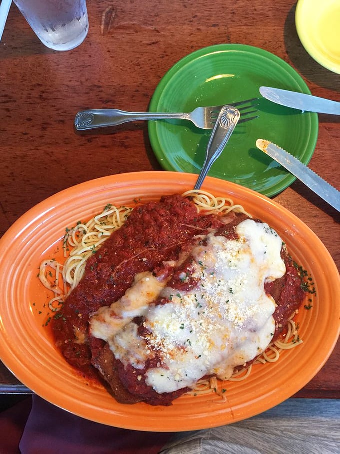 Chicken parmesan that's dressed for success – tender cutlet, vibrant sauce, and cheese melted to perfection over al dente pasta.