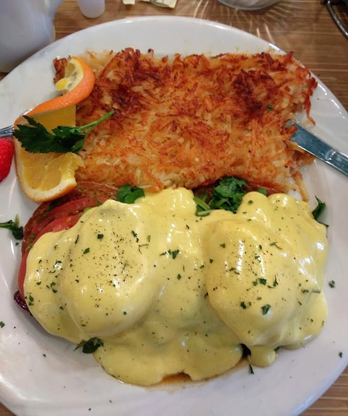 Eggs Benedict with perfectly crisp hash browns—the breakfast equivalent of wearing a tuxedo while still being comfortable.