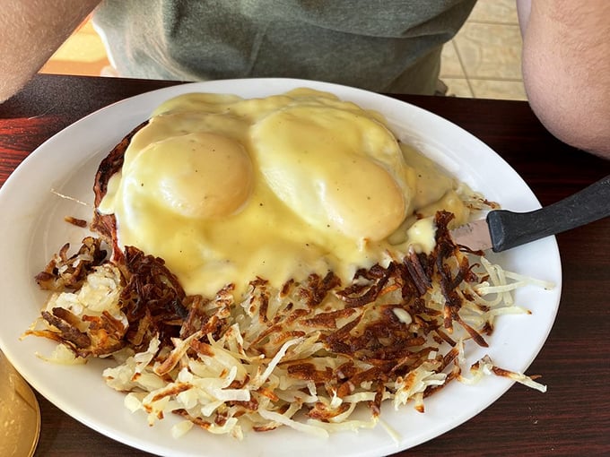 Eggs Benedict with a side of hash browns – the breakfast equivalent of wearing a tuxedo to the beach. Fancy yet perfectly at home.