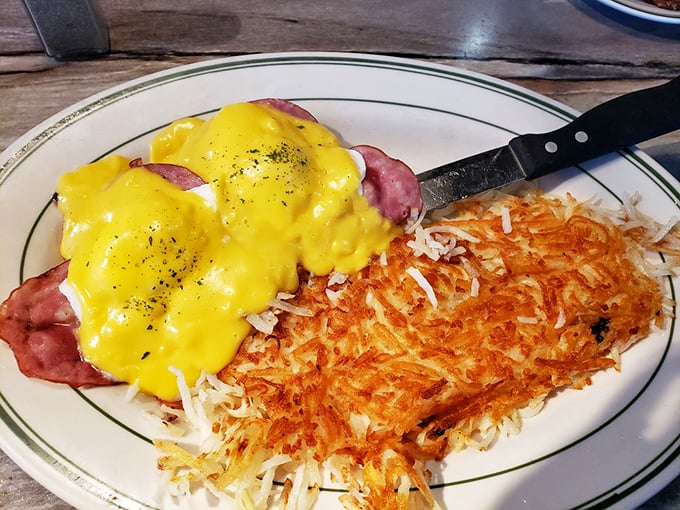 Eggs Benedict with hash browns so perfectly crispy, they make the morning news worth facing. Hollandaise diplomacy at its finest.