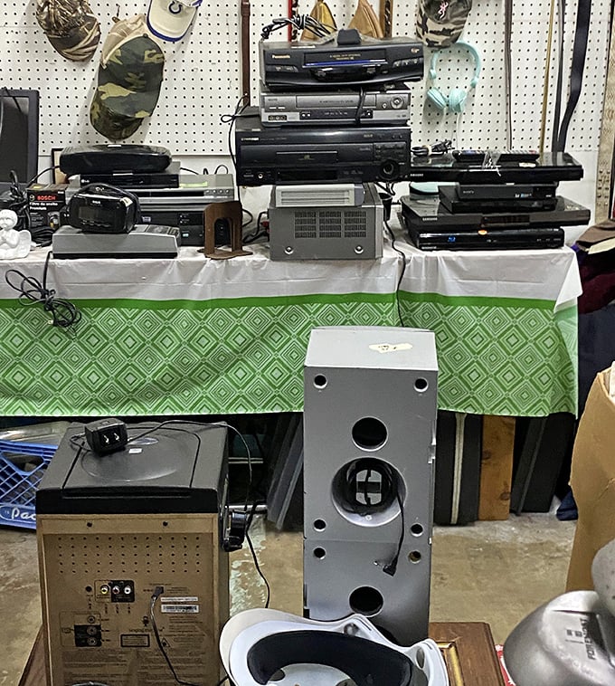 The electronics graveyard – where VCRs, DVD players, and stereo equipment await resurrection by retro-tech enthusiasts.