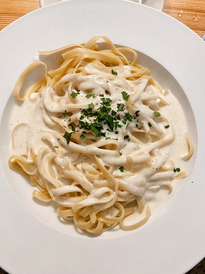 Fettuccine Alfredo so creamy and rich, it should come with its own warning label: "May induce immediate food coma and declarations of love."