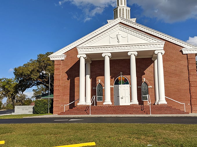 First Baptist Church's stately columns and brick facade represent the architectural grace that makes Brooksville's historic buildings so photogenic.