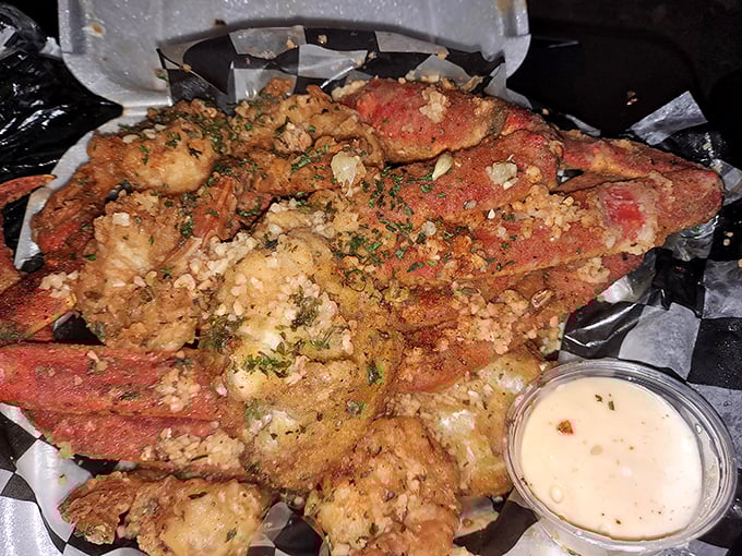 Fried crab legs and shrimp with a side of dipping sauce—because sometimes the best things in life require a little work and a lot of napkins. 