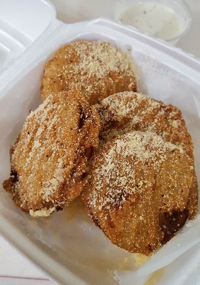 Golden-fried green tomatoes dusted with parmesan—a Southern classic that proves sometimes the best things in life are simple and crispy.