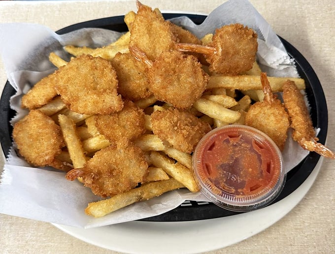 Golden-fried shrimp that snap between your teeth, served with fries and a dipping sauce that demands to be part of the conversation.
