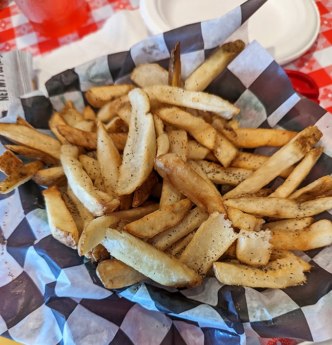 These seasoned fries understand their supporting role perfectly – crispy, flavorful sidekicks to the main seafood show above.