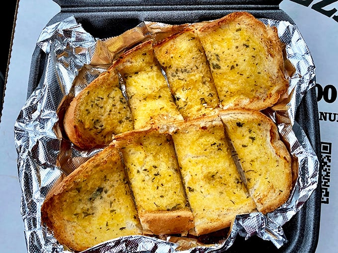 Garlic bread that could ward off vampires from three counties away. Those herbs aren't just garnish—they're a declaration of flavor intent.