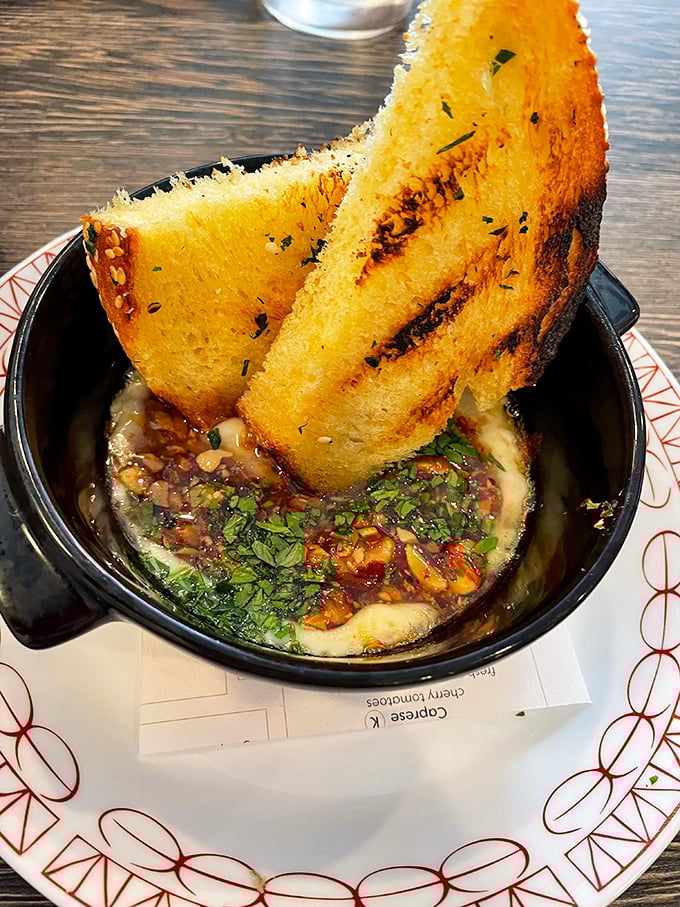 Garlic bread that's not playing around. This isn't your sad supermarket version – it's the heavyweight champion of the appetizer world.