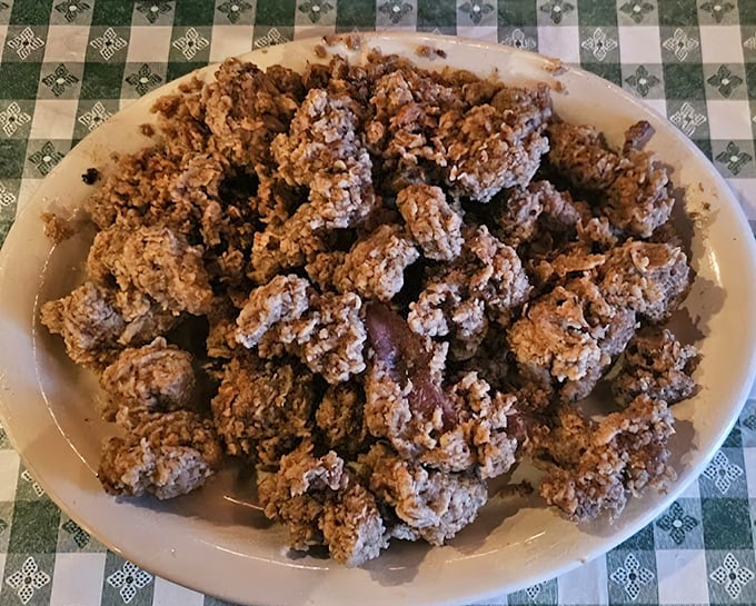 A platter of golden-fried gizzards that would convert even the most offal-averse eater. Crispy outside, tender inside—the perfect introduction.