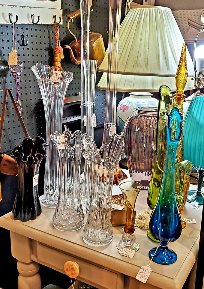 Crystal and colored glass catch the light like liquid jewels – each piece waiting for its starring role at your next dinner party.