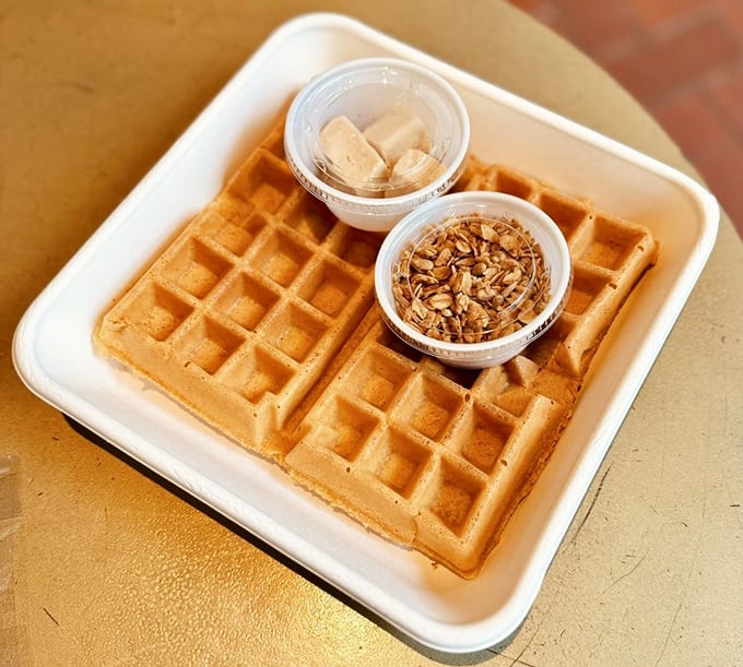 A waffle grid so perfect it could be used in mathematics class, with toppings that transform breakfast into an event worth celebrating.