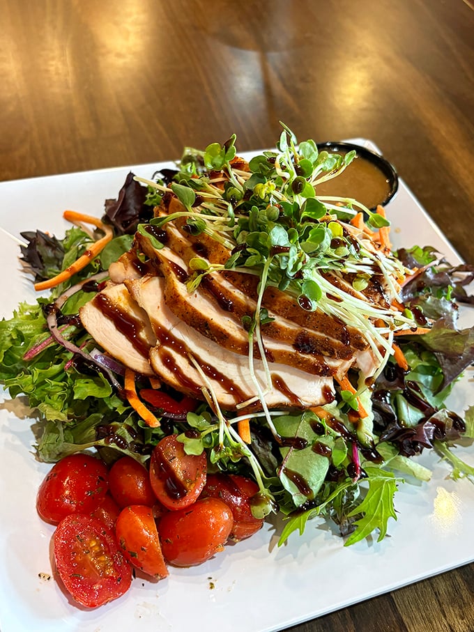 A salad that doesn't apologize for being healthy—it's too busy showing off that perfectly grilled chicken and garden-fresh produce.