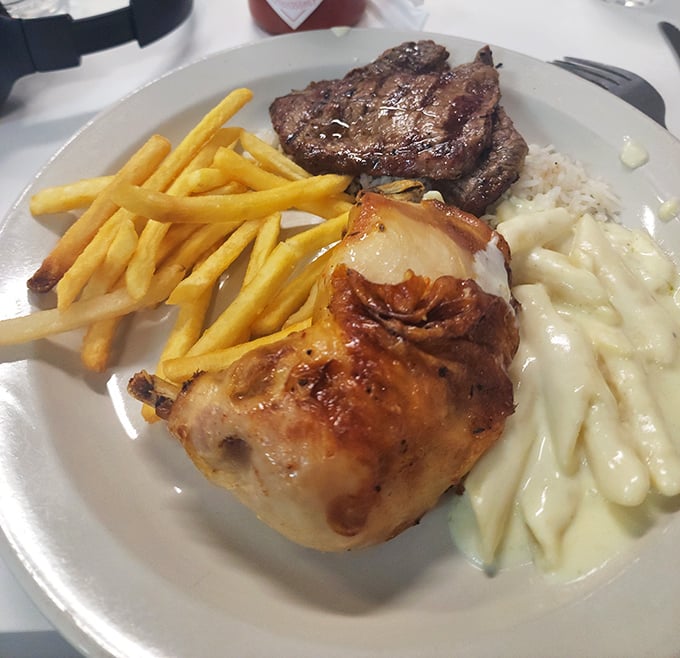 When chicken and steak share a plate with creamy pasta, it's not just a meal—it's a diplomatic summit of international comfort foods.