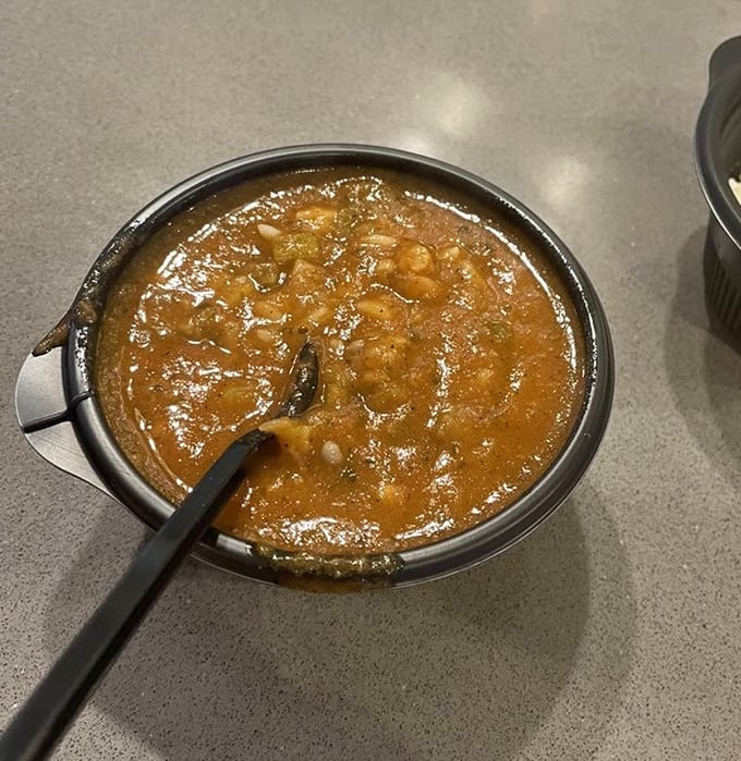 A bowl of gumbo that looks like it contains all the secrets of coastal cooking, with a richness that tells you someone's grandmother had a hand in this recipe.