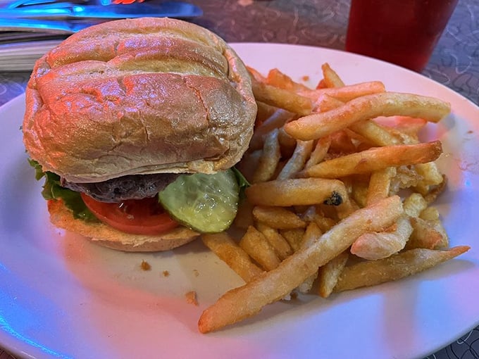 The burger and fries combo—America's most perfect food pairing since peanut butter met jelly, executed with diner precision and zero pretension.