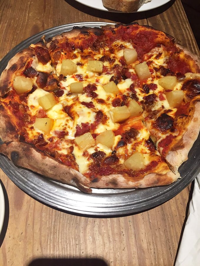 The Hawaiian pizza debate ends here—this perfect balance of savory and sweet with crispy-edged pineapple chunks converts even the skeptics.