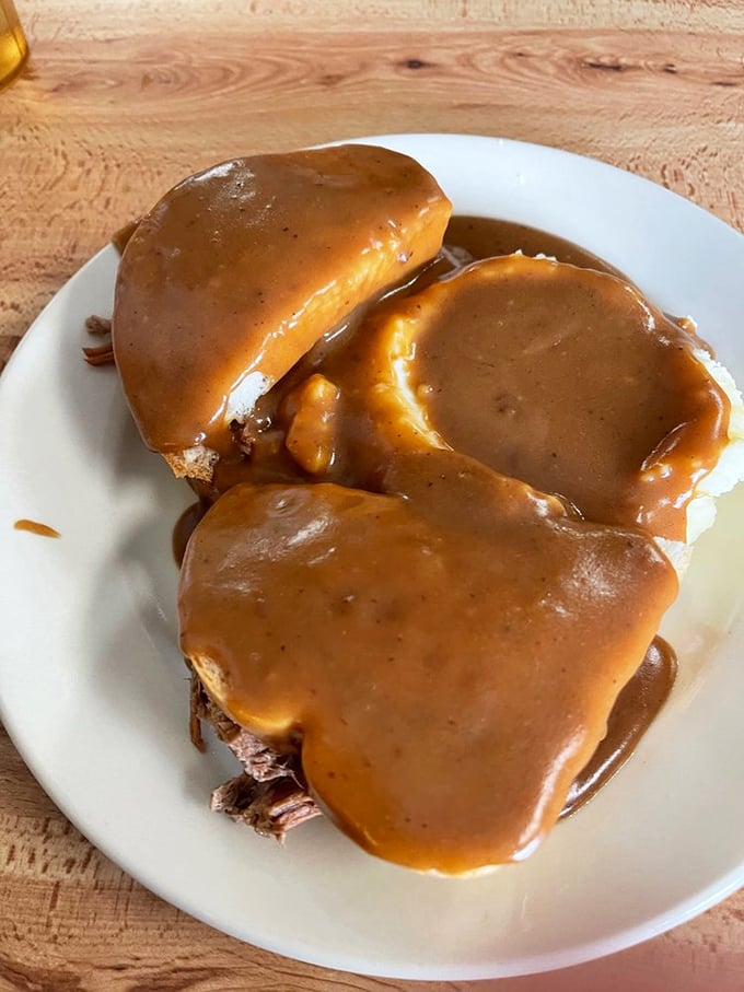 Hot beef sandwich swimming in gravy—the kind of comfort food that makes you want to hug the chef and take a nap.