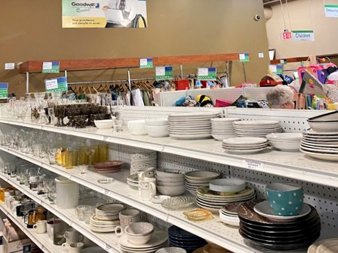 Plates, bowls, and serving pieces arranged with surprising precision. Someone's wedding registry rejects become your eclectic dinner party collection—at a fraction of department store prices.