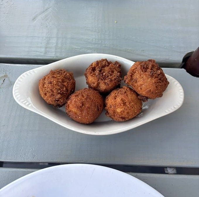 Hushpuppies that achieve the golden ratio of crispy exterior to fluffy interior—the unsung heroes of any proper seafood feast.