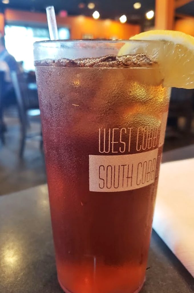 Sweet tea so perfectly amber it could be mistaken for liquid topaz, served in a glass that proudly announces its Georgia heritage.