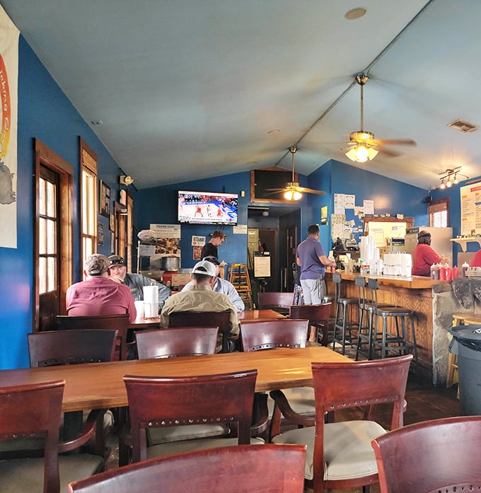 The counter seating isn't just functional—it's front-row tickets to the greatest show on earth: watching barbecue masters at work.