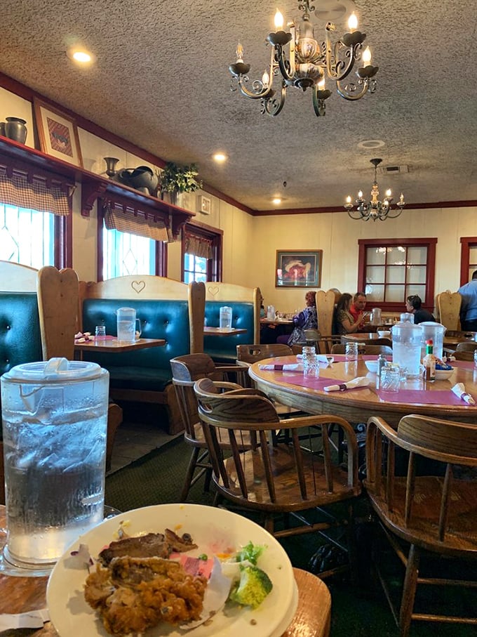 Blue booths, wooden chairs, and chandeliers create that rare dining atmosphere where both grandma and hipsters feel equally at home.