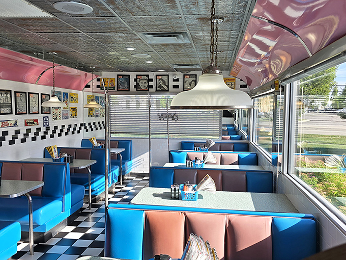 The diner's interior doesn't just serve food—it serves nostalgia without the surcharge. Those pendant lights have illuminated first dates and family traditions alike.