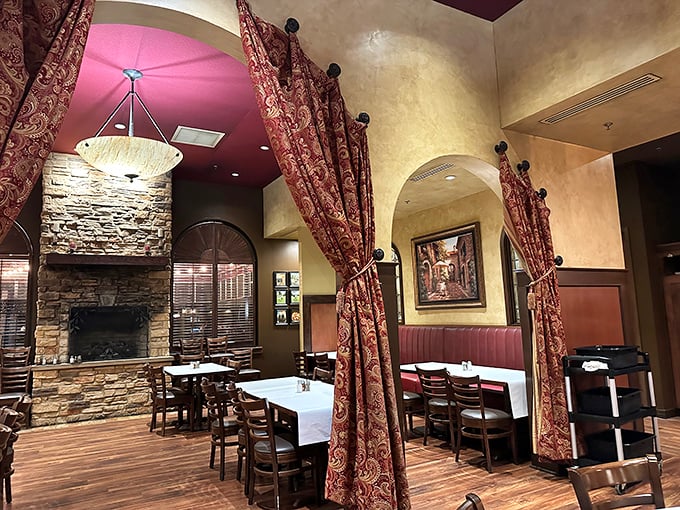 The stone fireplace anchors the dining room like a warm hearth in an Italian country home – minus the distant cousin who won't stop talking politics.