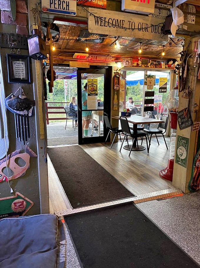 The doorway to outdoor bliss—where "Welcome to Our Deck" isn't just a sign, it's an invitation to dine with a view of nature's finest.