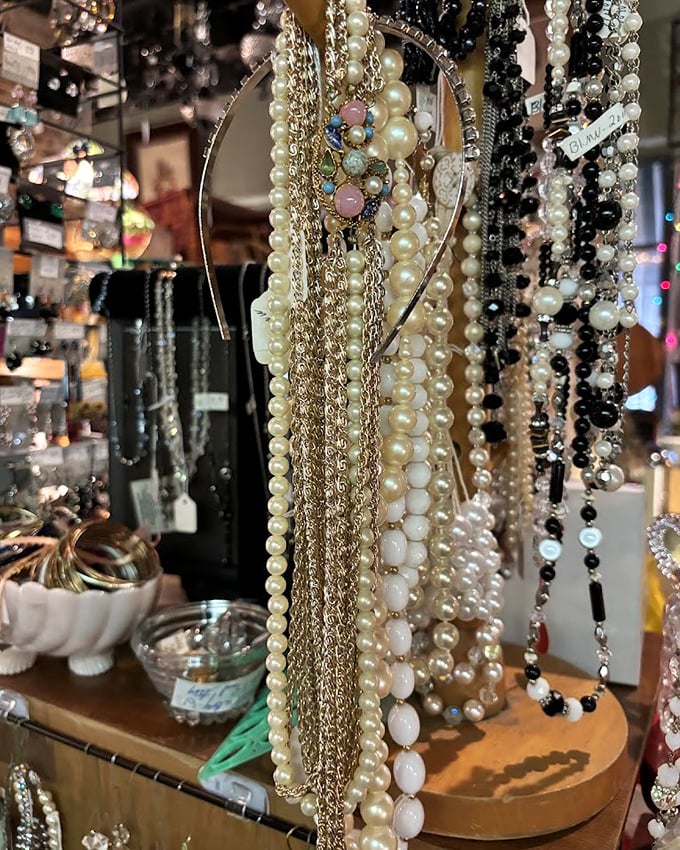Pearls and chains cascade like elegant waterfalls of nostalgia—jewelry that once adorned someone's special night out, now waiting for its next adventure.