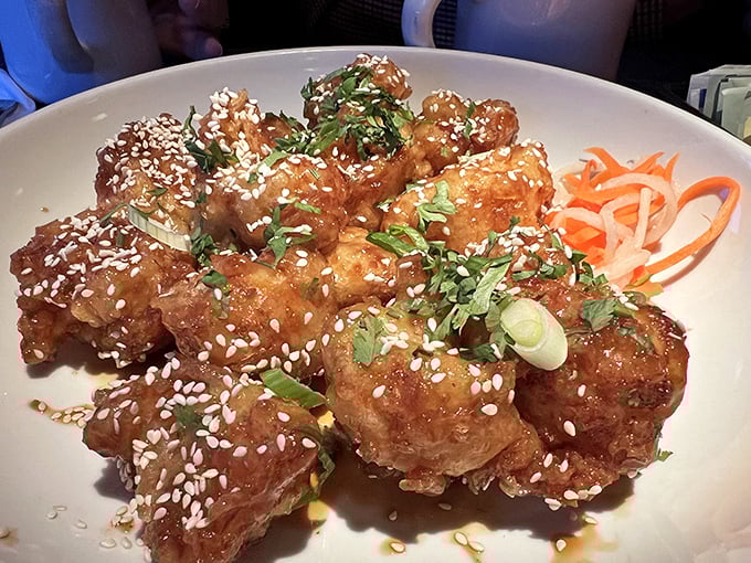 Korean-inspired cauliflower that could convert even dedicated carnivores—crispy, sticky, and sprinkled with sesame seeds and scallions for the perfect finish.