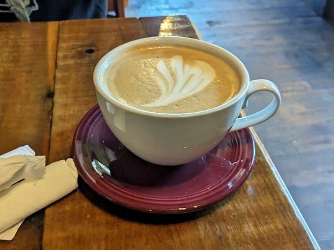 Latte art so pretty you almost don't want to drink it. Almost. The burgundy saucer adds a touch of diner-meets-café elegance.