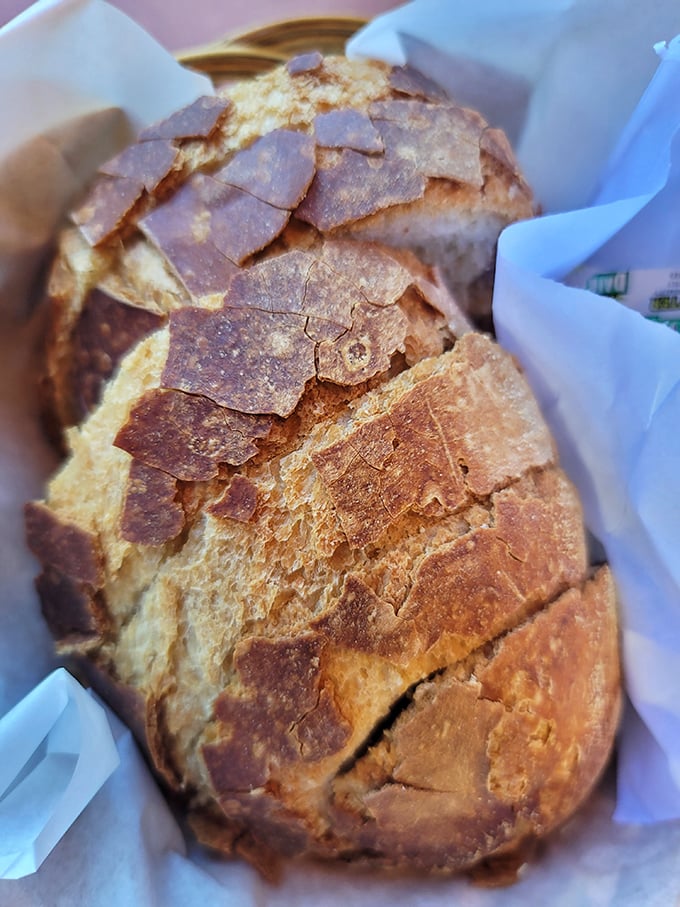 This sourdough loaf isn't just bread; it's an architectural achievement with a crackling crust that announces its presence with a symphony of crunch.