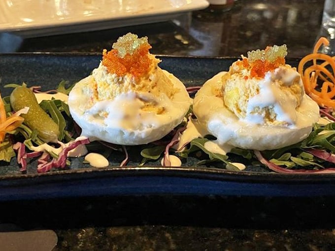 Deviled eggs elevated to art form with caviar on top—grandma's picnic favorite just got a serious promotion.