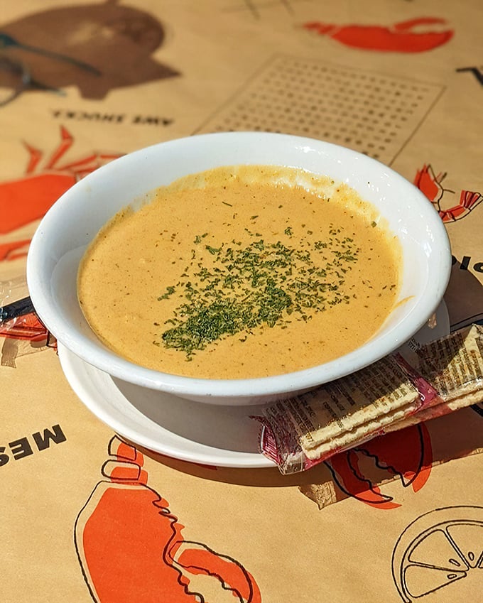 Lobster bisque that's dressed in its Sunday best. Velvety, rich, and garnished with herbs – soup that demands to be savored slowly. 