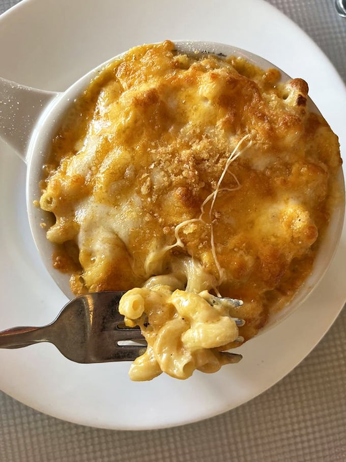 Mac and cheese that's achieved the perfect golden crust – the kind that makes you want to break through it like a crème brûlée.