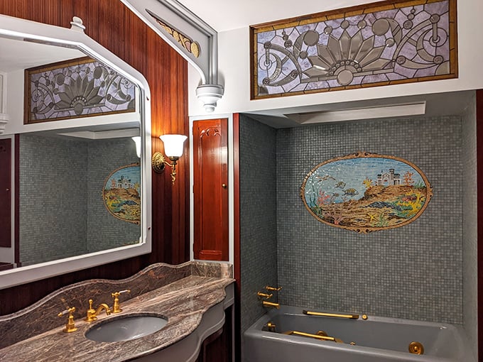 A bathroom fit for royalty with stained glass and nautical mosaics. Indoor plumbing never looked so magnificent—or took so long to install.