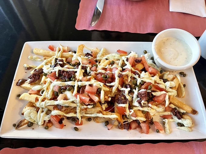 These aren't just fries—they're a Mediterranean vacation, where tomatoes, feta, and a drizzle of sauce transform the humble potato into something worth fighting over.